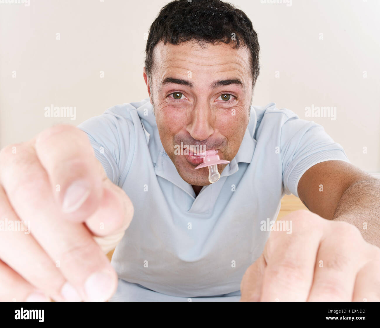 Portrait of man with pacifier Stock Photo - Alamy