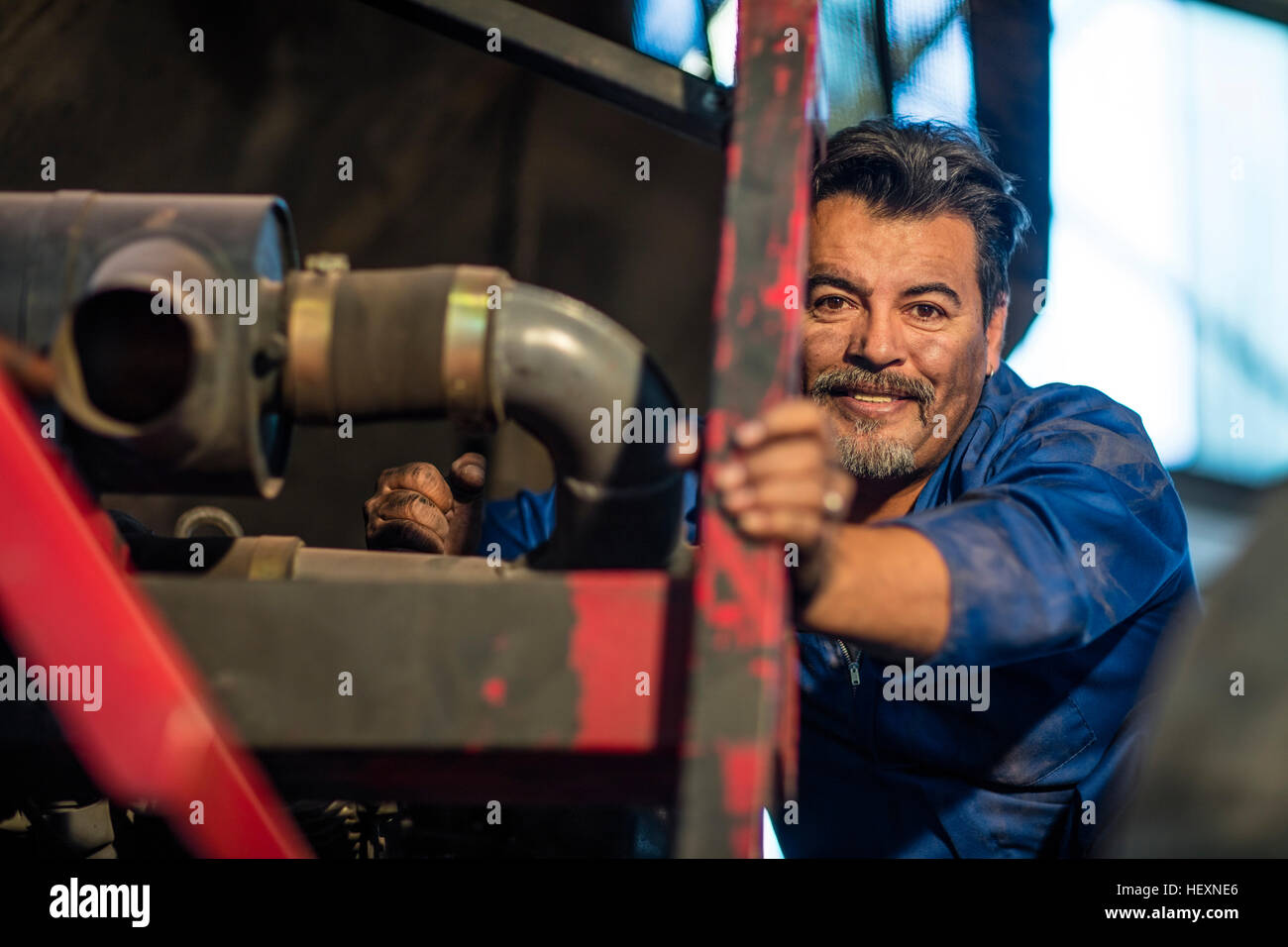Mechanic working at fire brigade workshop, portrait Stock Photo - Alamy