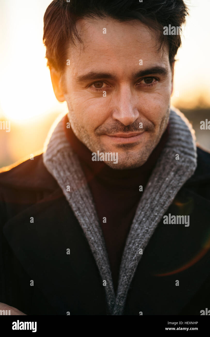 Portrait of man with stubble at sunset Stock Photo - Alamy