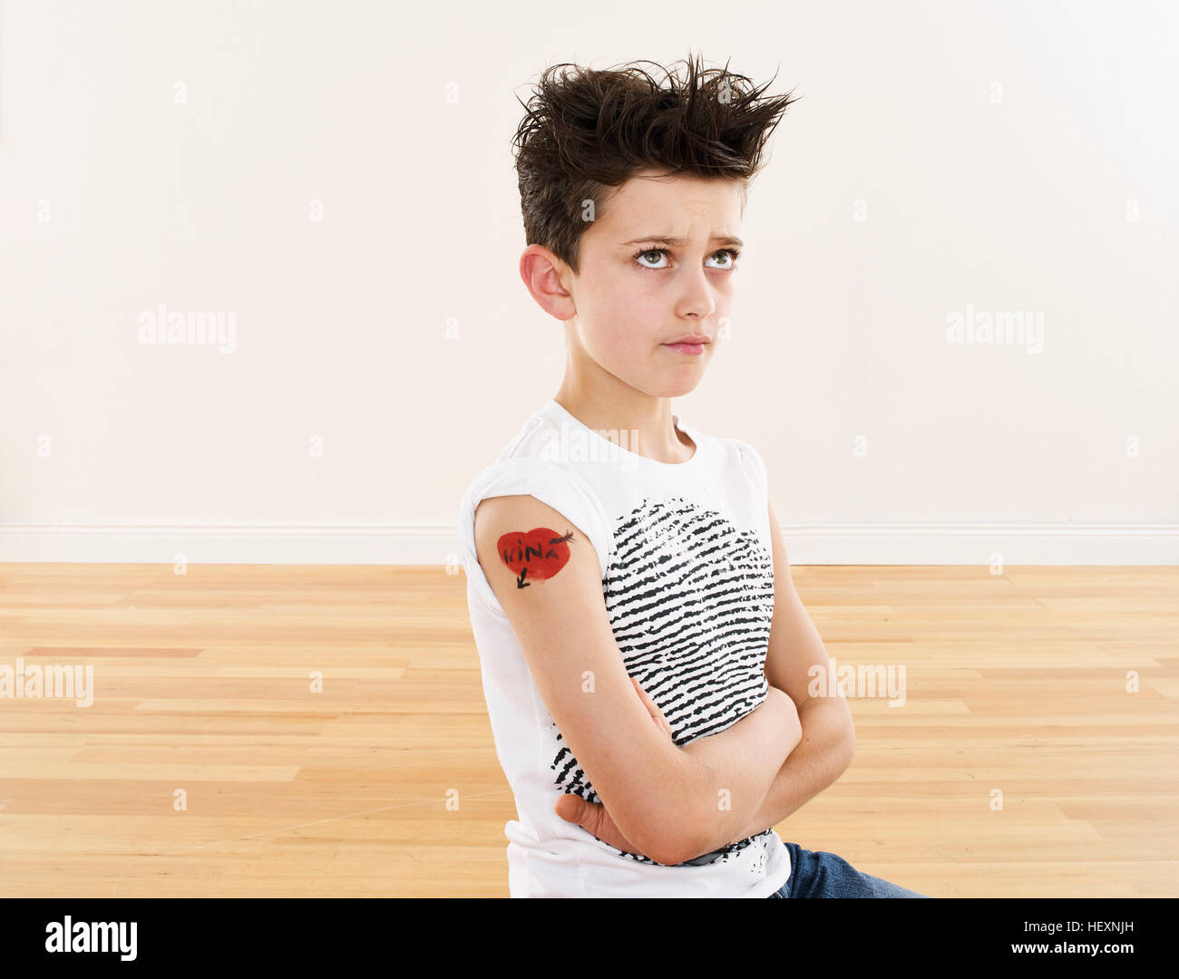 Boy with tattoo arm hi-res stock photography and images - Alamy