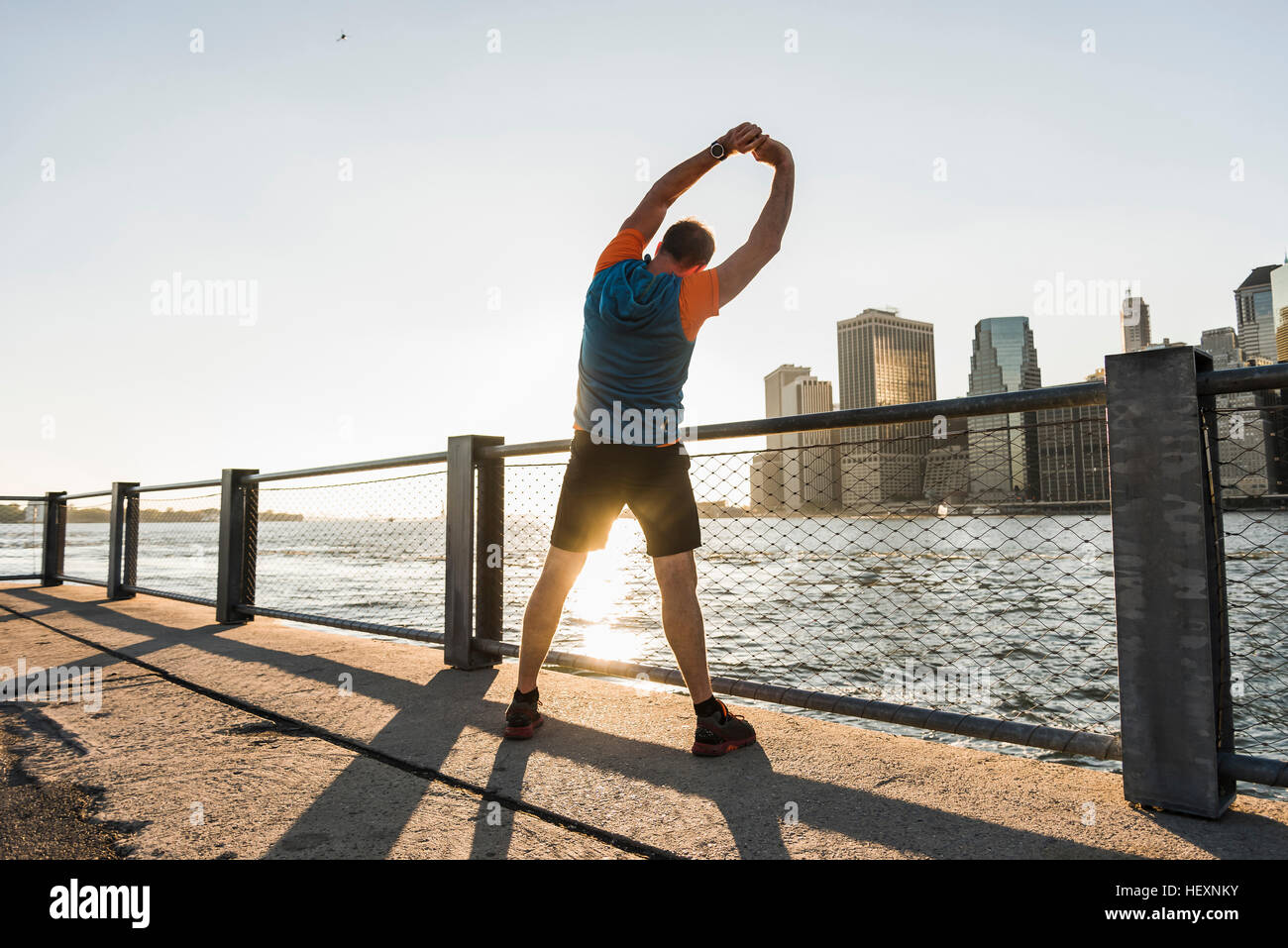 Back view of man doing stretching hi-res stock photography and images ...