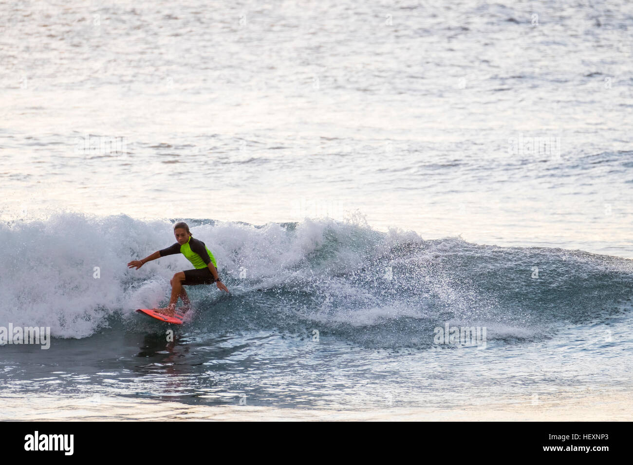Boy surfing in the sea Stock Photo - Alamy