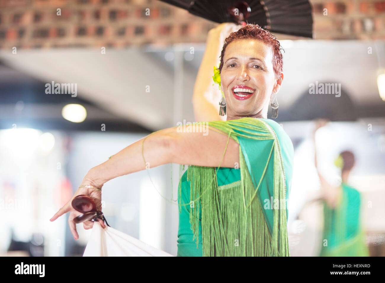 Smiling female senior latin dancer Stock Photo - Alamy