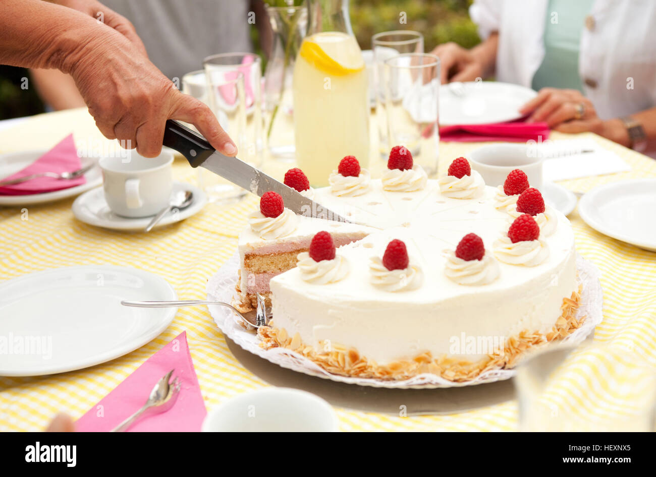 Hand cutting cream cake Stock Photo - Alamy