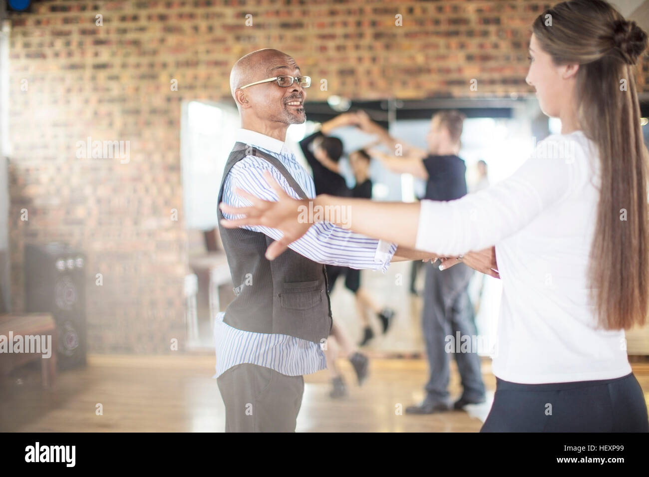Dance instructor teaching class in studio Stock Photo - Alamy