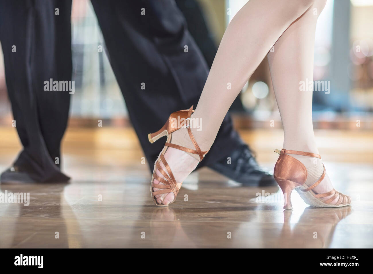 Feet of dancing couple in studio Stock Photo - Alamy