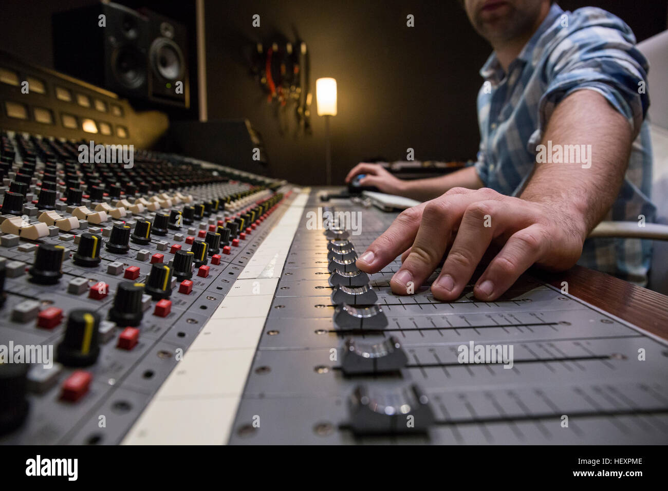 Hand of a man working in the control room of a recording studio Stock ...