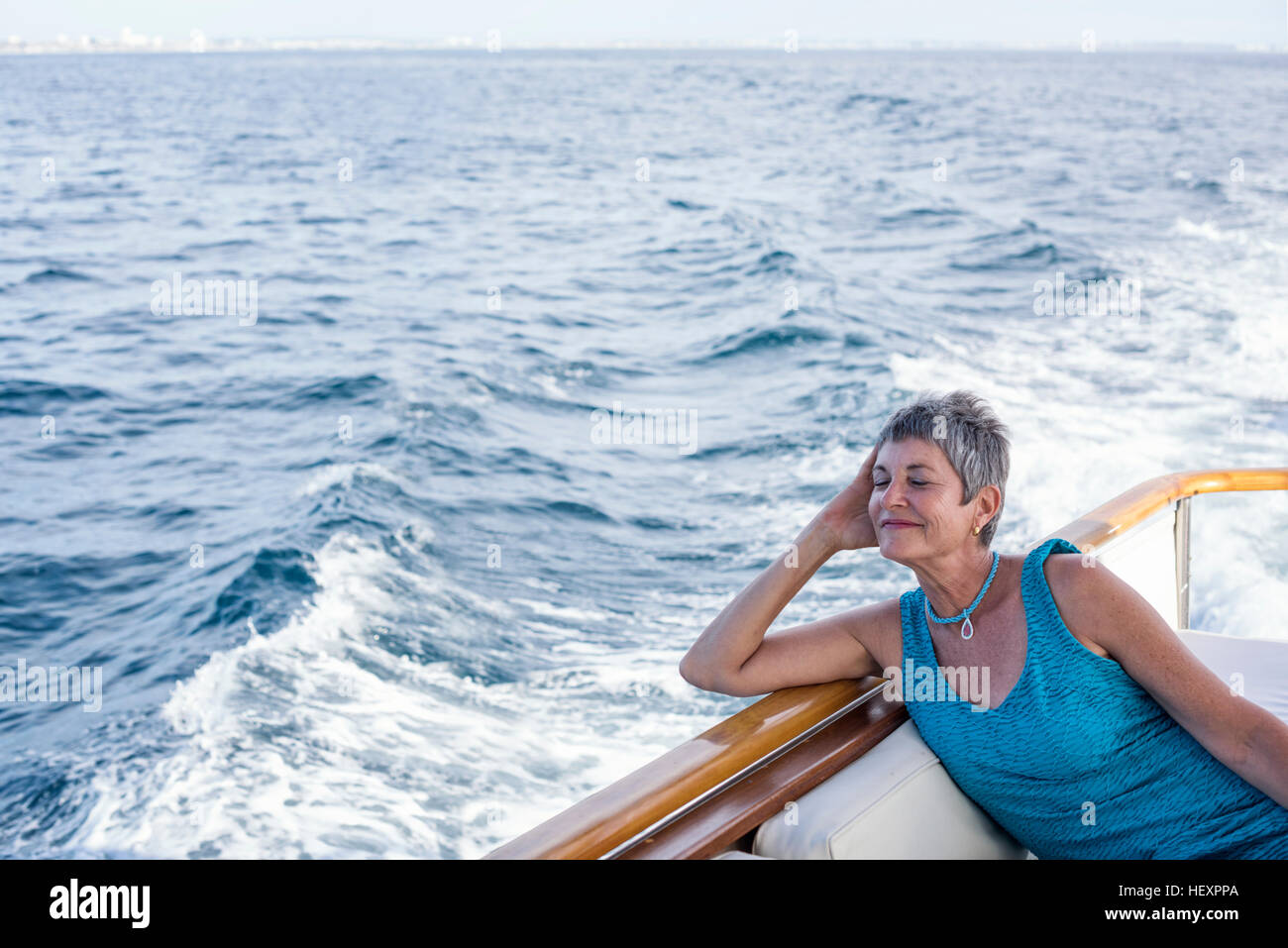 Smiling woman on a boat trip Stock Photo - Alamy