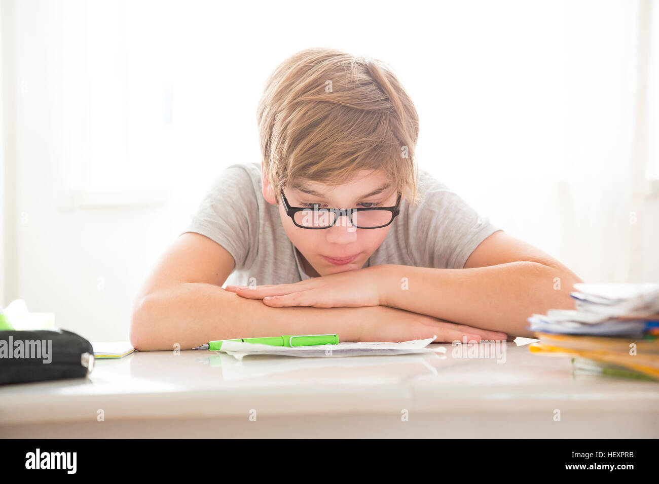 Boy doing homework Stock Photo - Alamy