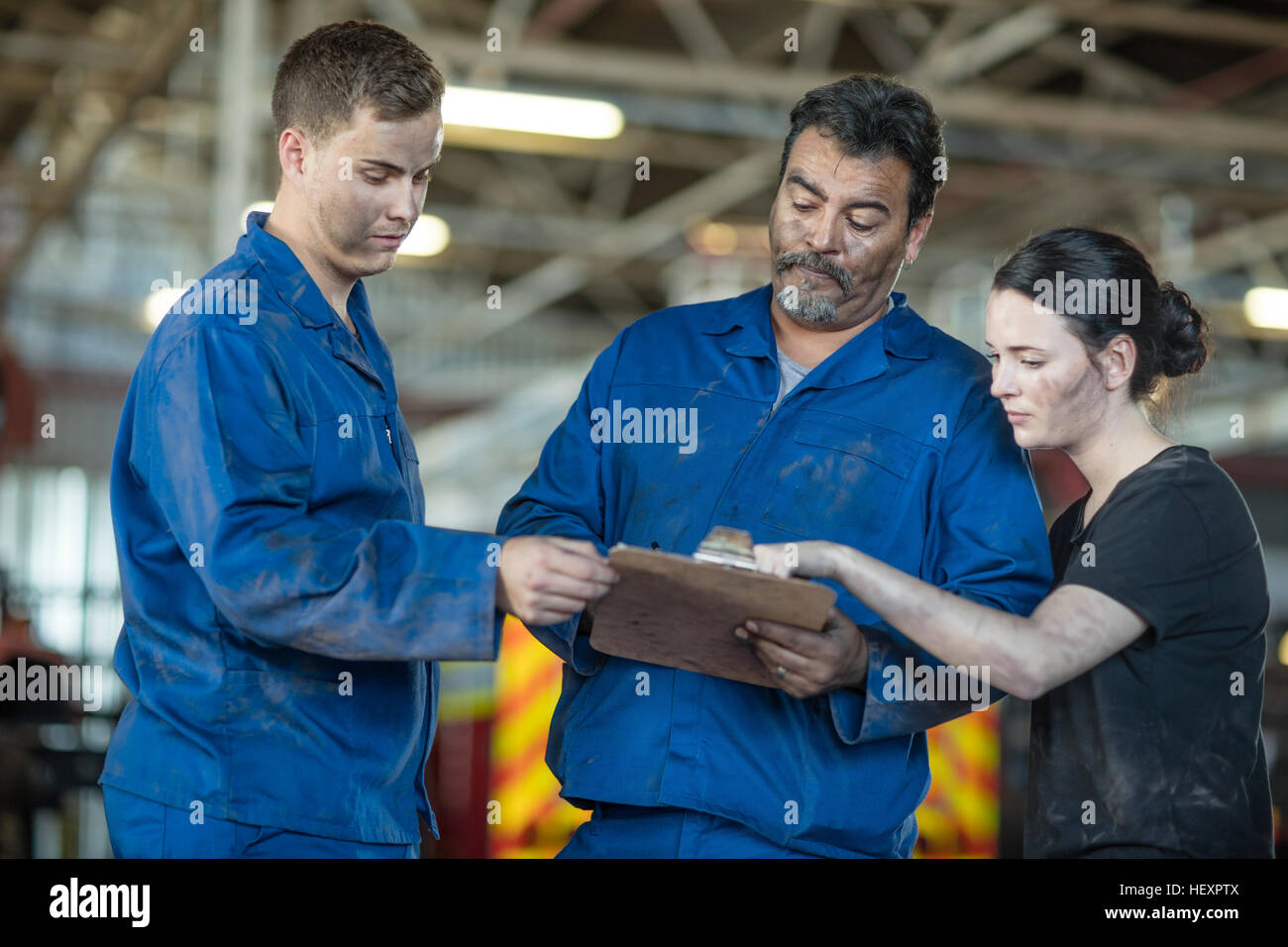 Mechanics working at fire brigade workshop hi-res stock photography and ...