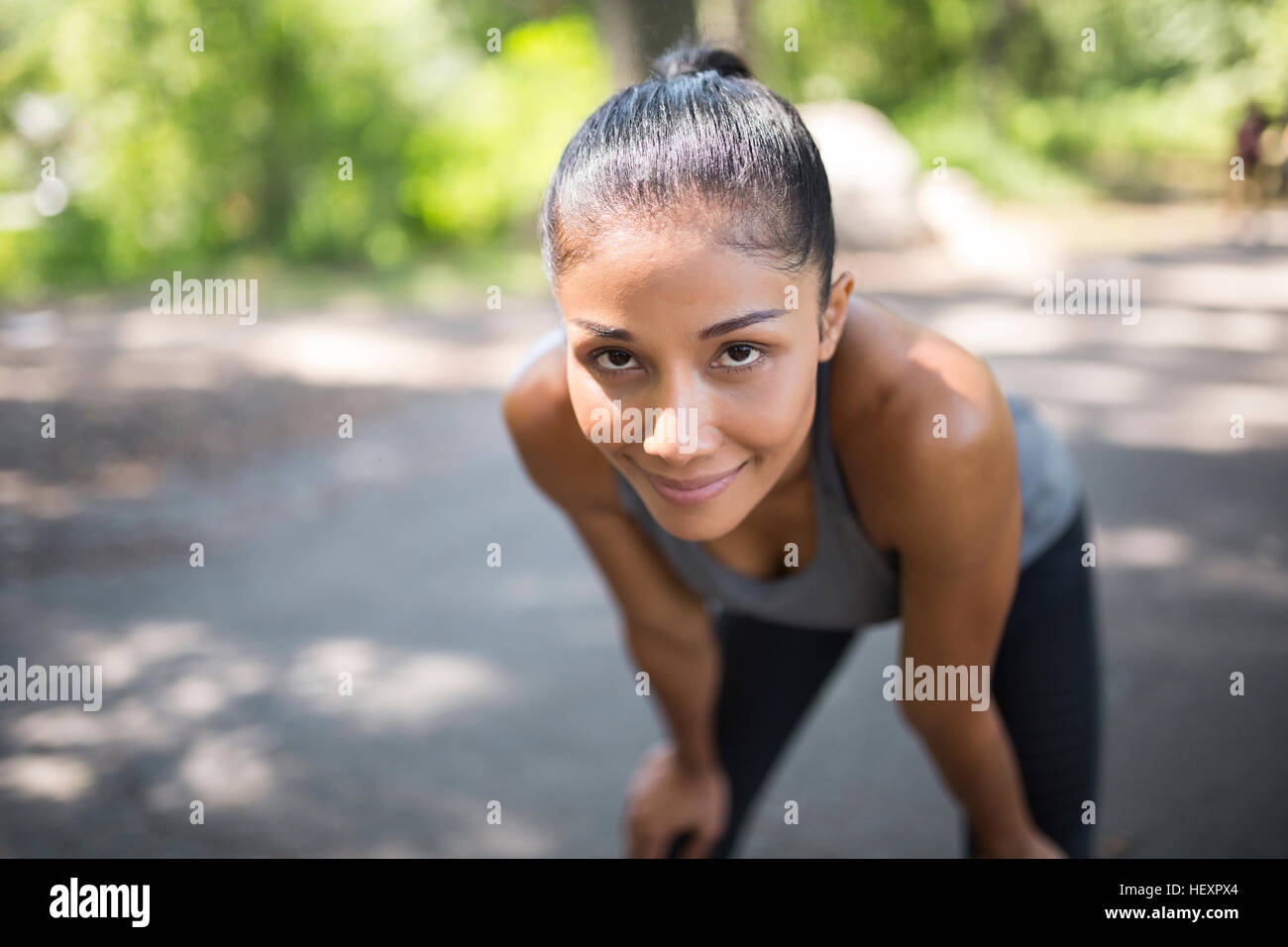 Portrait of confident female athlete relaxing Stock Photo - Alamy Portrait of confident female athlete relaxing Stock Photo - Alamy