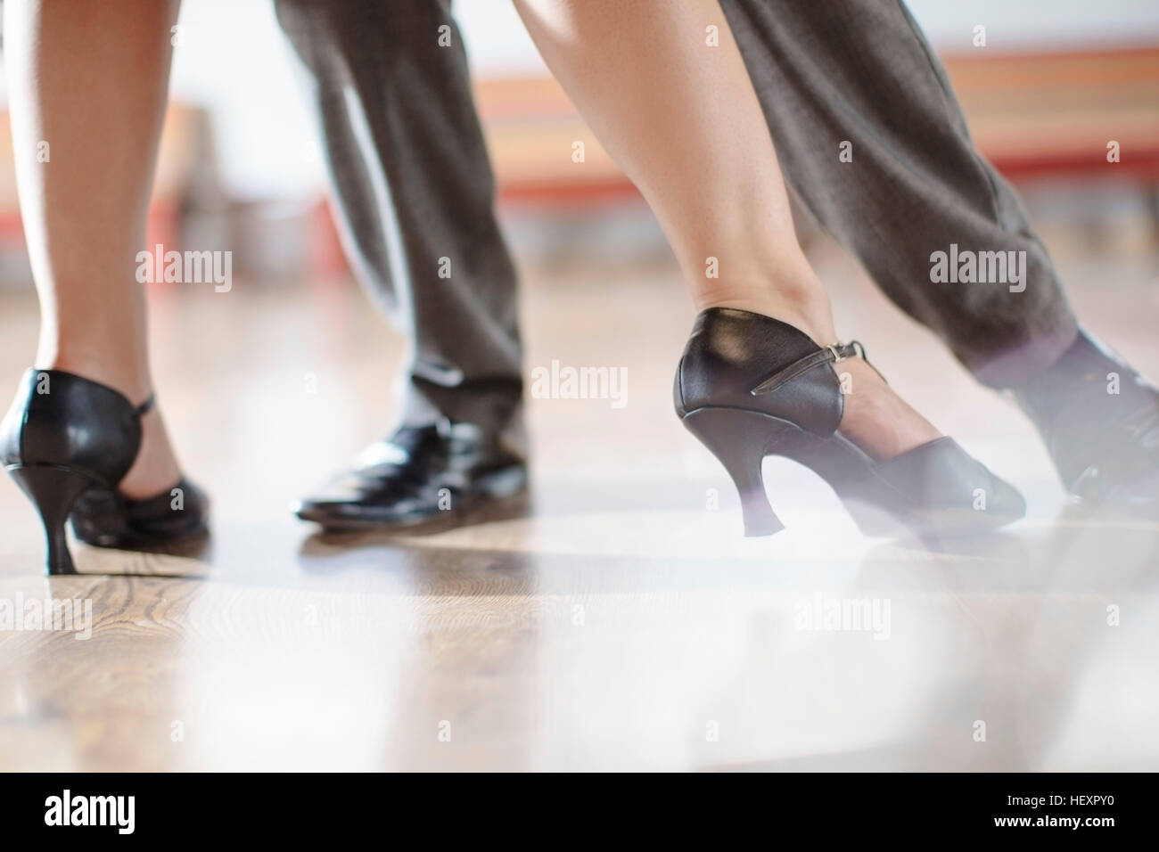 Feet of dancing couple in studio Stock Photo - Alamy