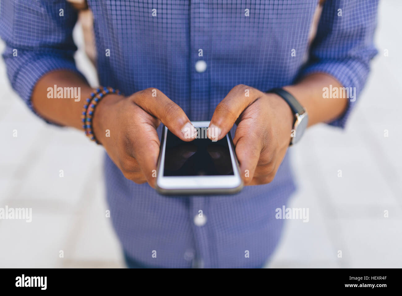 Hands of young man using smartphone Stock Photo - Alamy