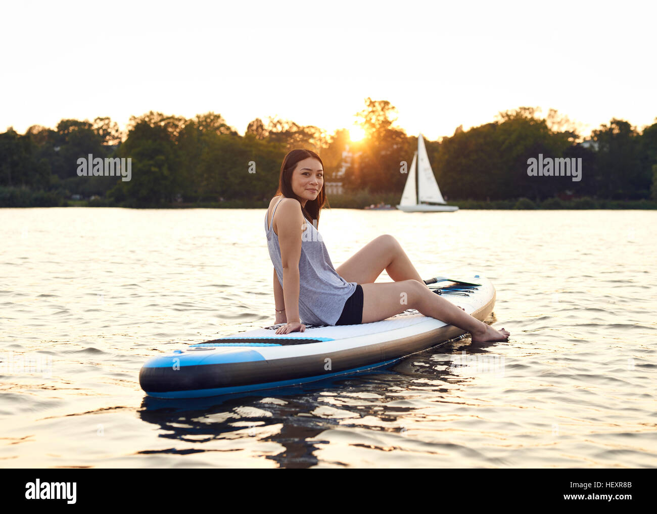 Asian woman on paddleboard hi-res stock photography and images - Alamy