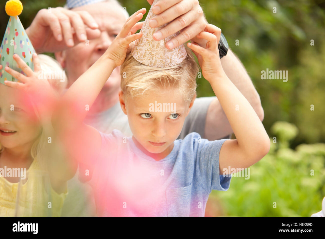 Putting on hat child hi-res stock photography and images - Alamy