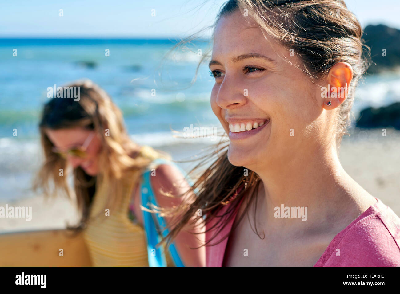 Two happy women on the beach Stock Photo - Alamy