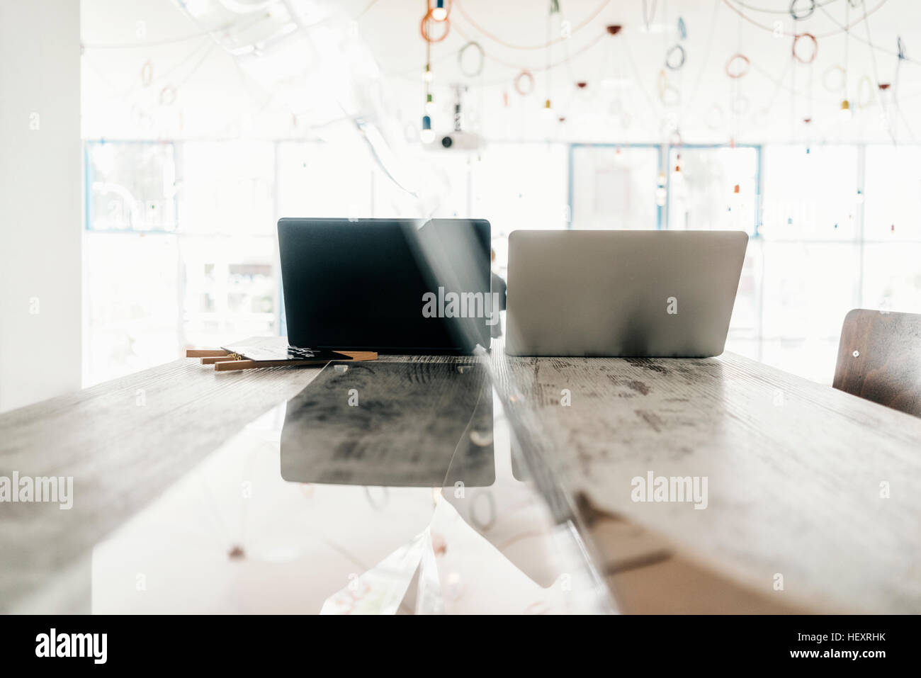 Two laptops on work desk Stock Photo - Alamy