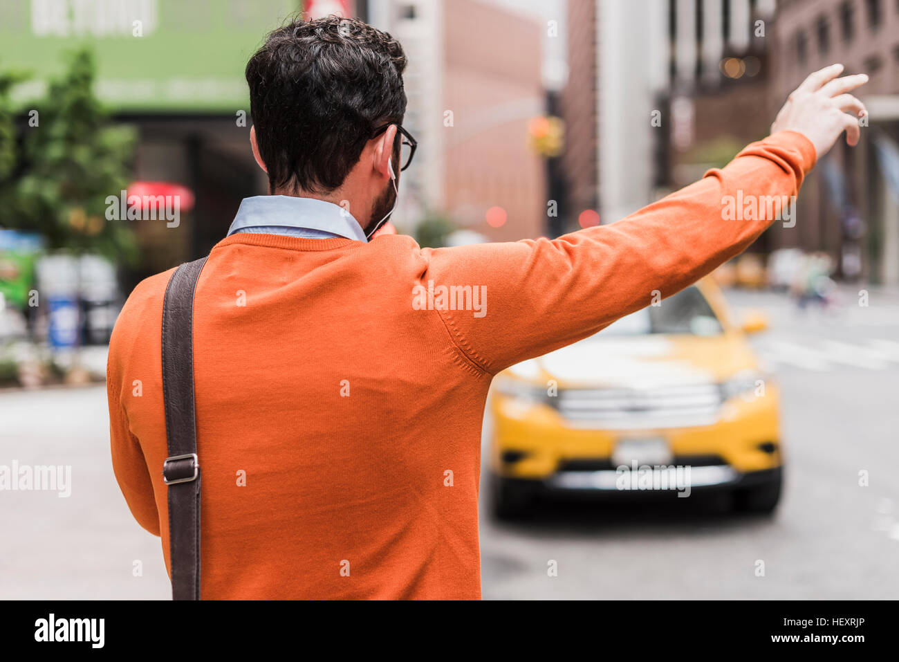 USA, New York City, Businessman hailing cab Stock Photo - Alamy