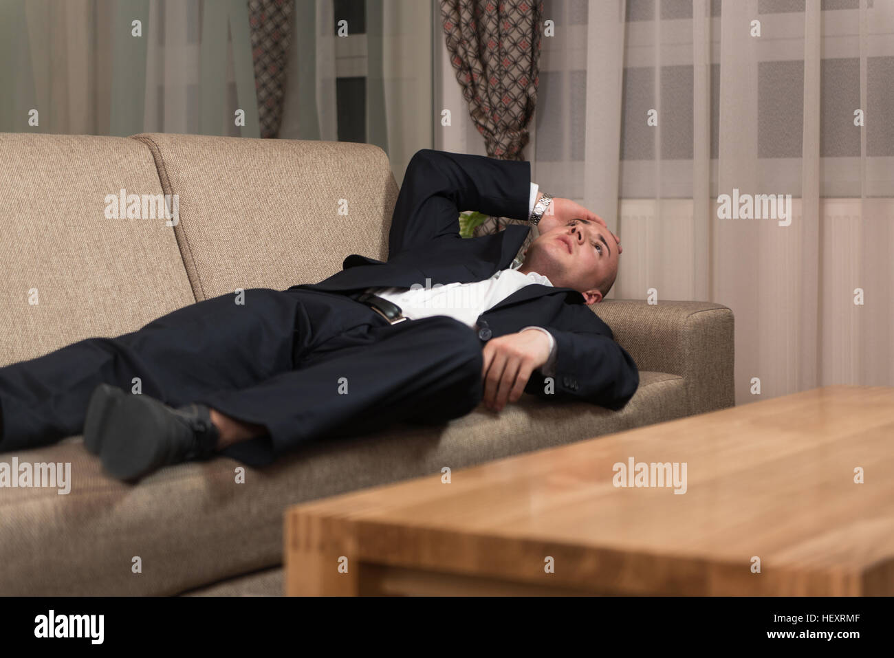 Handsome Young Man in Suit and Tie Sleeping or Resting in Sofa Stock ...