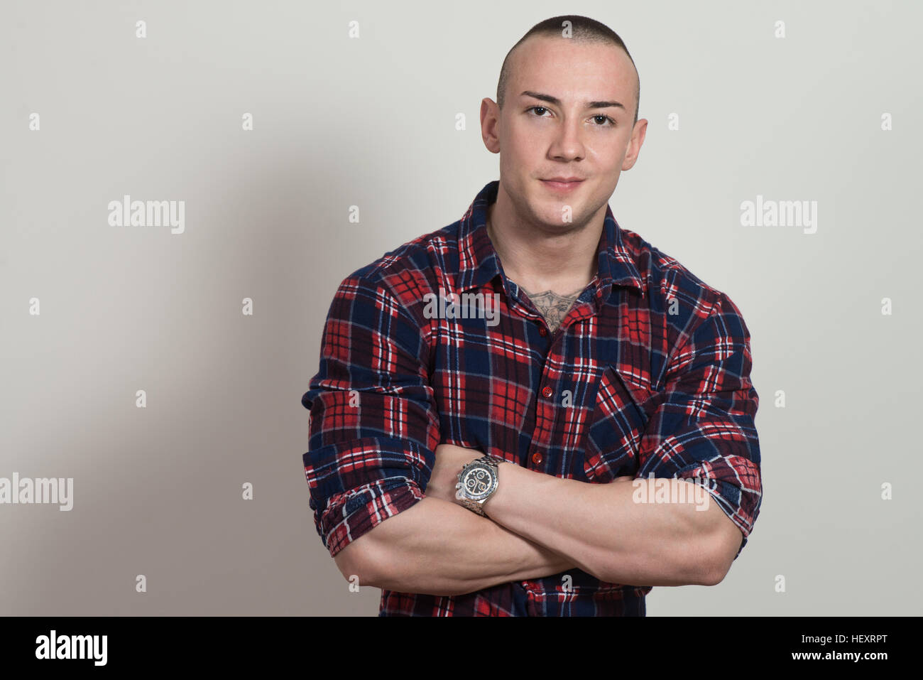 Portrait of Handsome Man With Crossed Hands Over Gray Background Stock ...