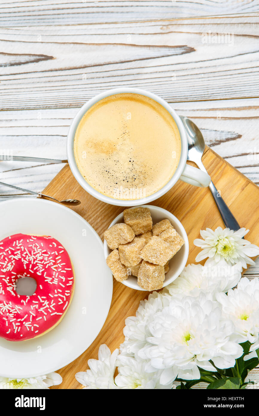 Donut and coffee on wooden background Stock Photo - Alamy