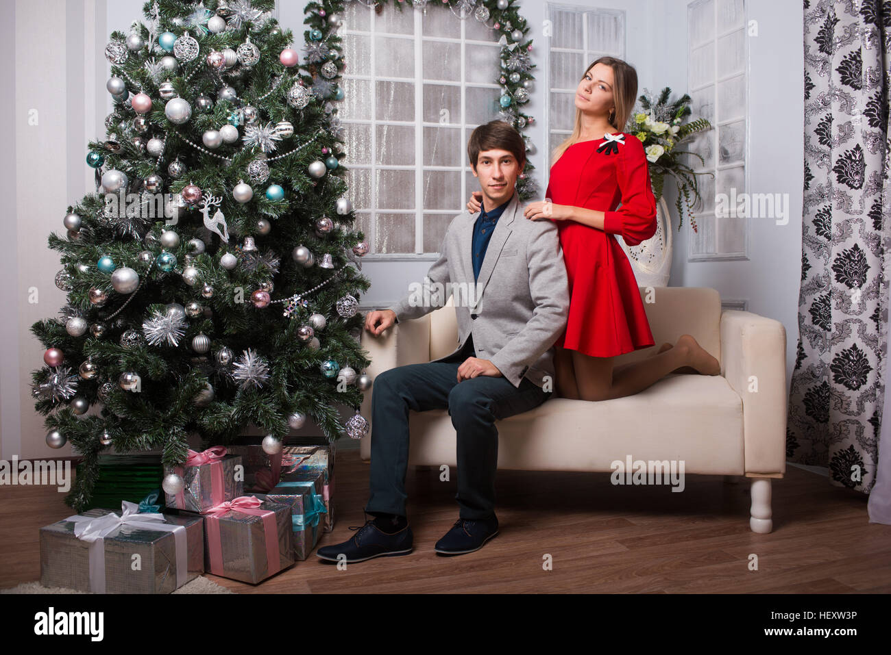 Beautiful couple at Christmas on the Christmas tree for New Year Stock ...