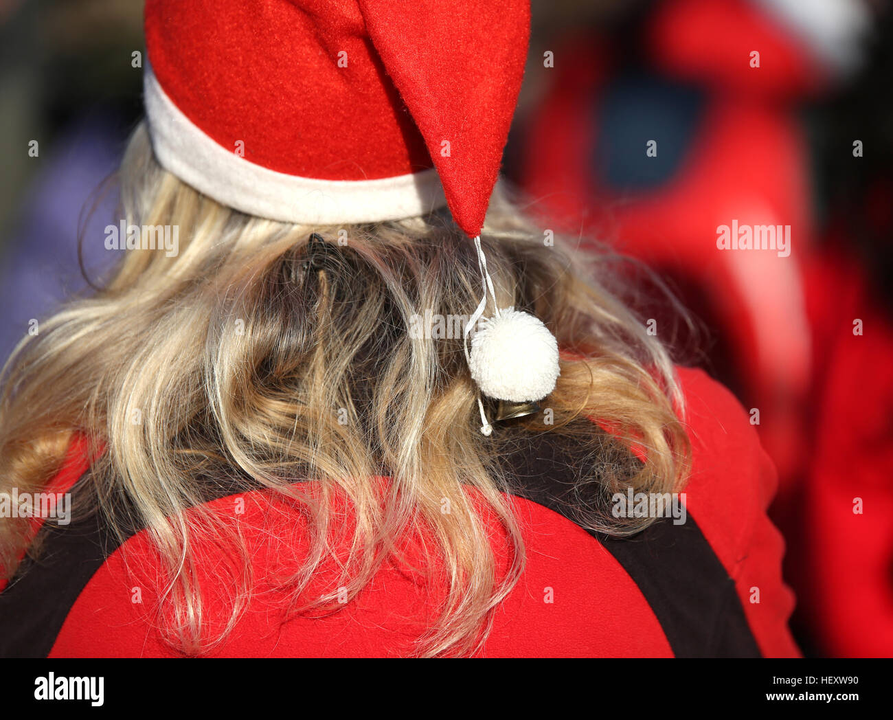 woman with long blonde hair with a Santa Claus dress Stock Photo - Alamy