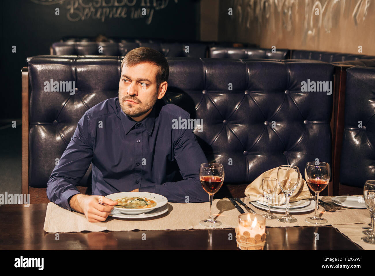 Serious blonde woman restaurant hi-res stock photography and images - Alamy