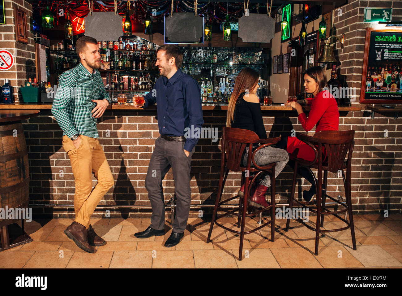 bar,two men talking, friends drink Stock Photo - Alamy