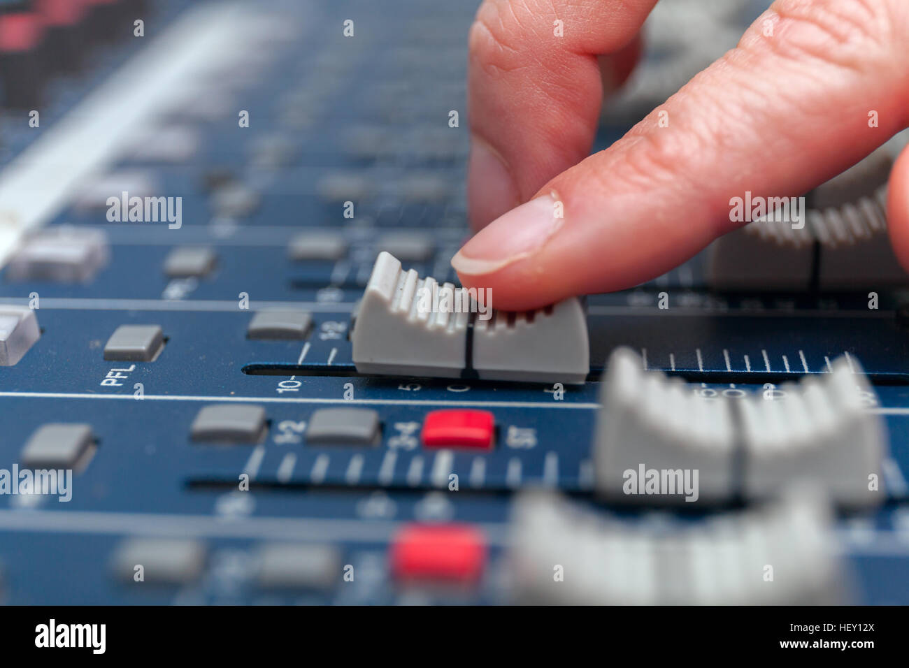 selective focus finger tuning of sound mixer Stock Photo - Alamy