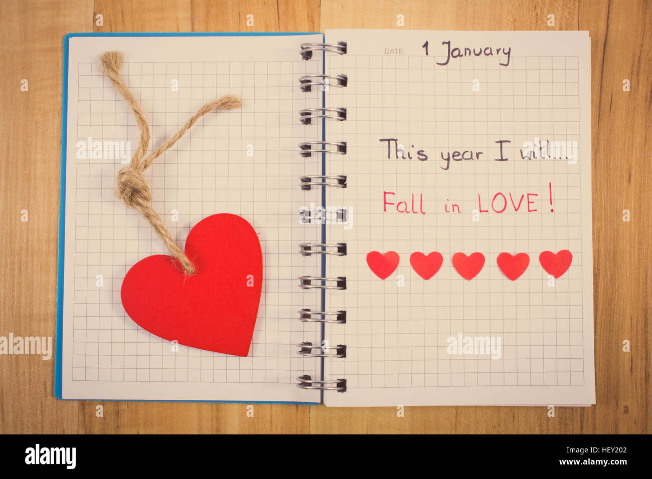 Vintage photo, New year resolution fall in love written in notebook ...