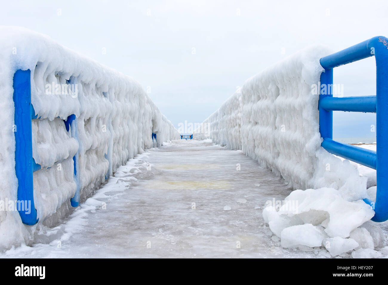 ice formation on blue railing on Lake Michigan pier Stock Photo - Alamy