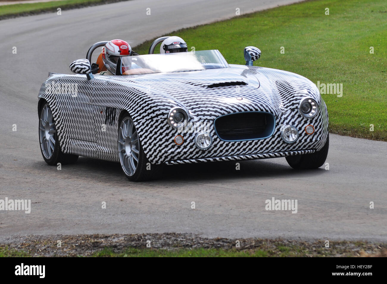 Racing up the hill climb at the 2016 Goodwood Festival of Speed, UK ...