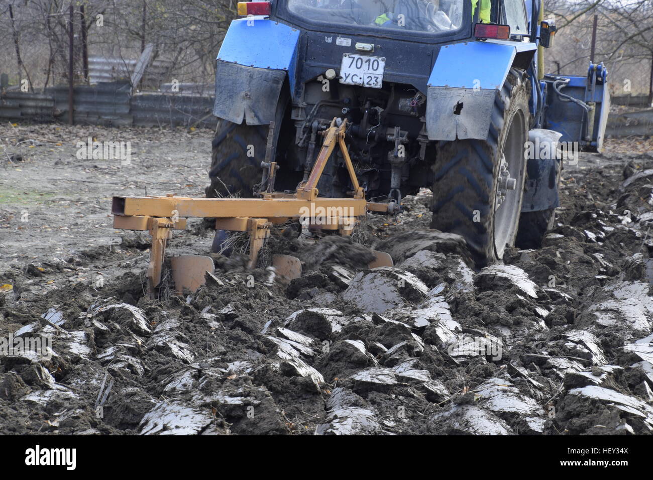 Tractor plowing the garden. Plowing the soil in the garden Stock Photo ...