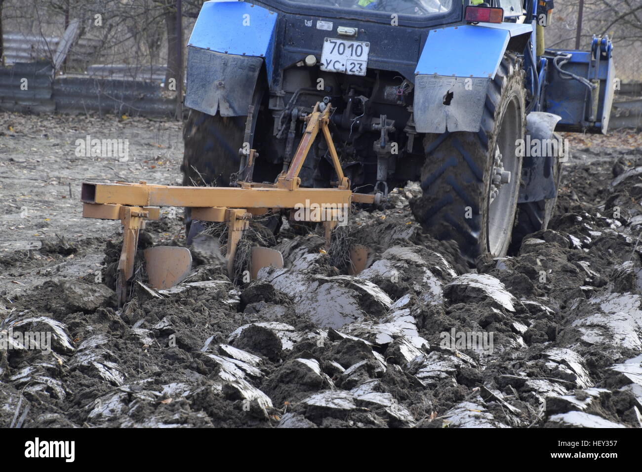Tractor plowing the garden. Plowing the soil in the garden Stock Photo ...
