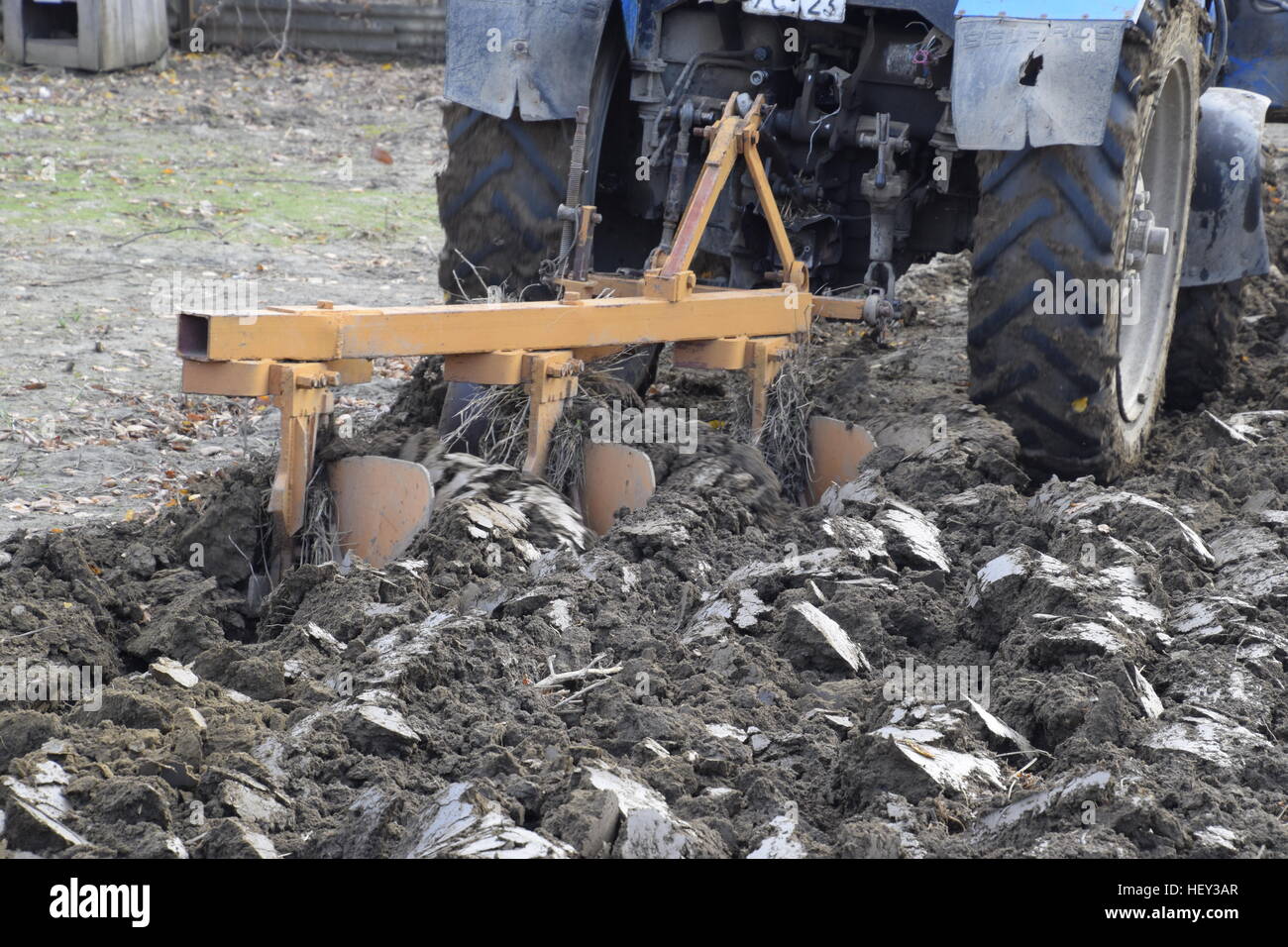 Tractor plowing the garden. Plowing the soil in the garden Stock Photo ...