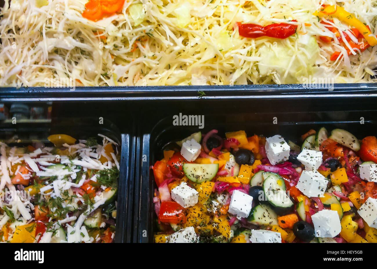 Showcase with vegetable salad at the store Stock Photo - Alamy
