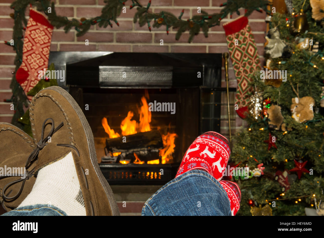 Relaxing by the fire Stock Photo - Alamy