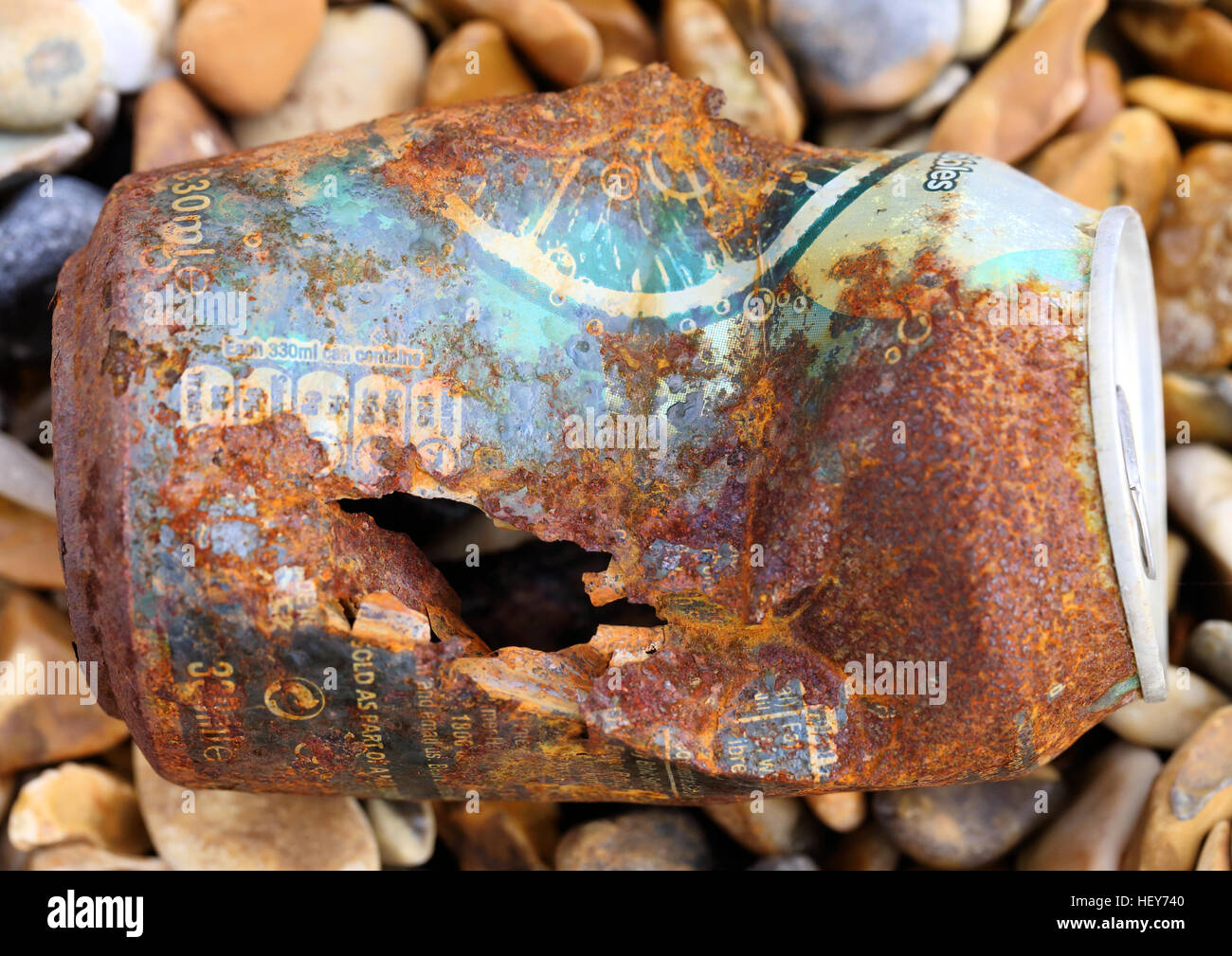 Rusted tin can washed up on a beach Stock Photo - Alamy