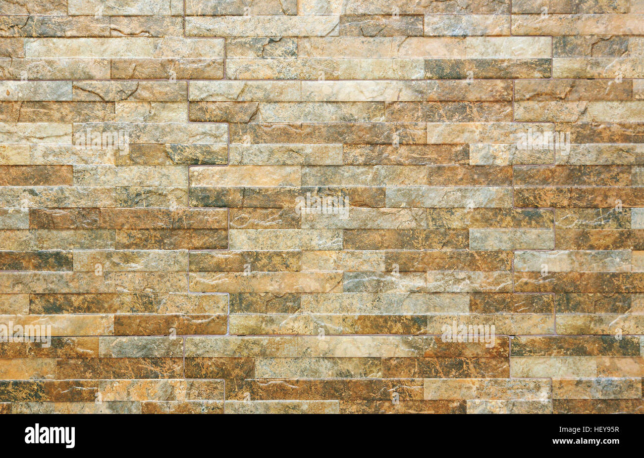 ceramic tile under a brick on the wall Stock Photo - Alamy