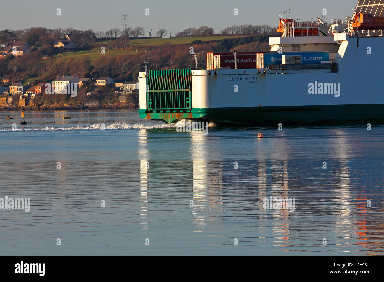 Very large boat turning to face up stream in calm blue waters with the ...