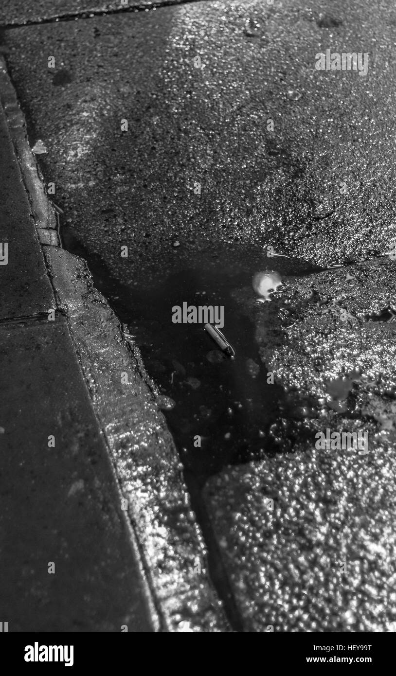 Puddle of water in street hi-res stock photography and images - Alamy