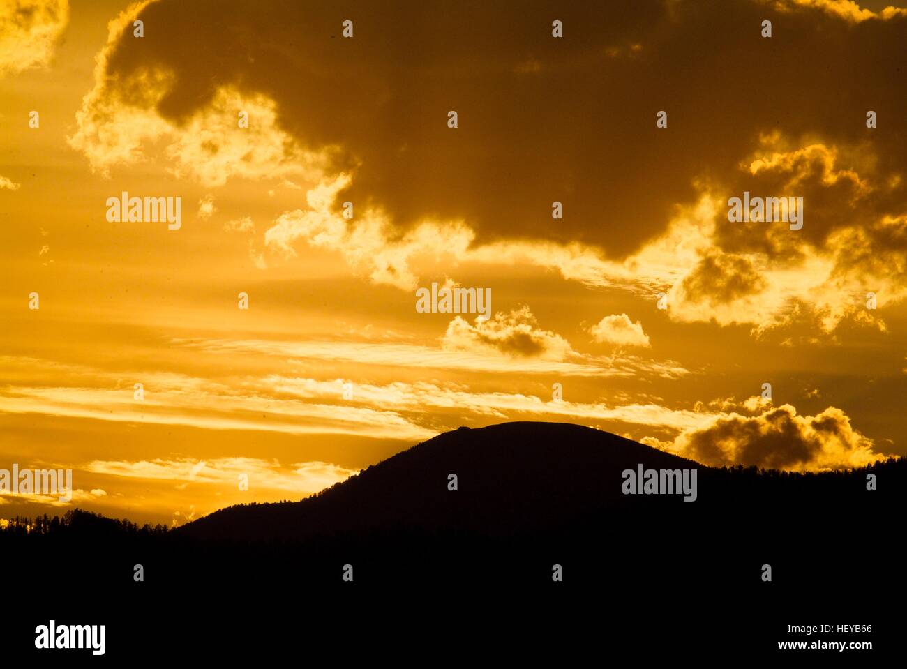 Sun seting over the Sayan mountains at tayga Stock Photo - Alamy