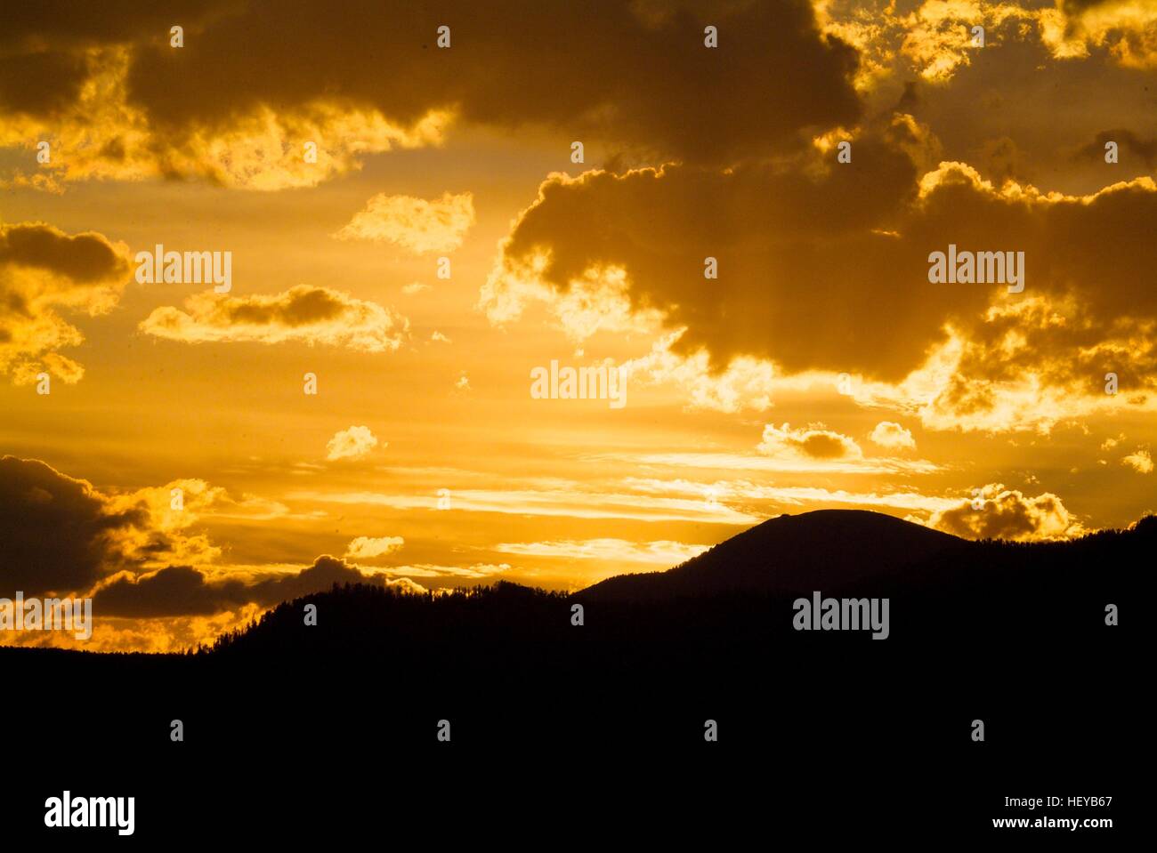 Sun seting over the Sayan mountains at tayga Stock Photo - Alamy