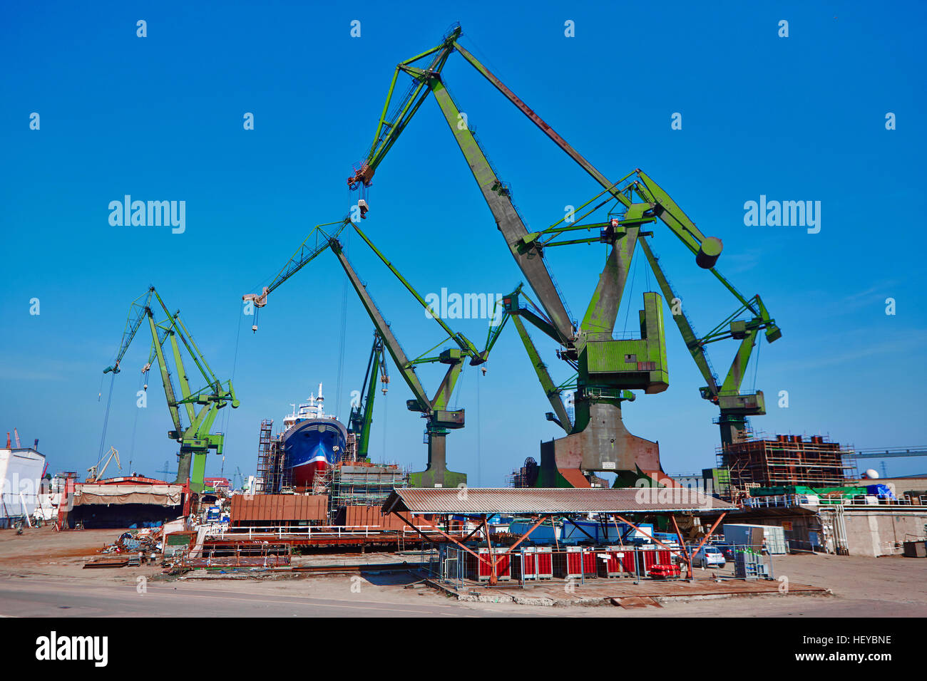 Tower cranes at shipyard Stock Photo - Alamy
