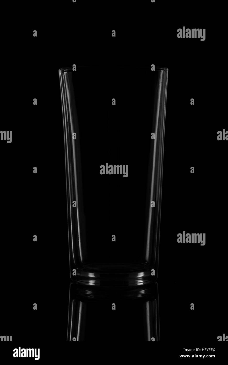 Empty glass on a black background with reflection Stock Photo - Alamy