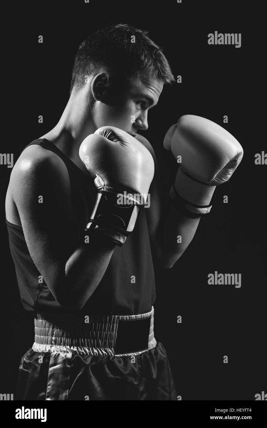 Young boxer sportsman on black background Stock Photo - Alamy