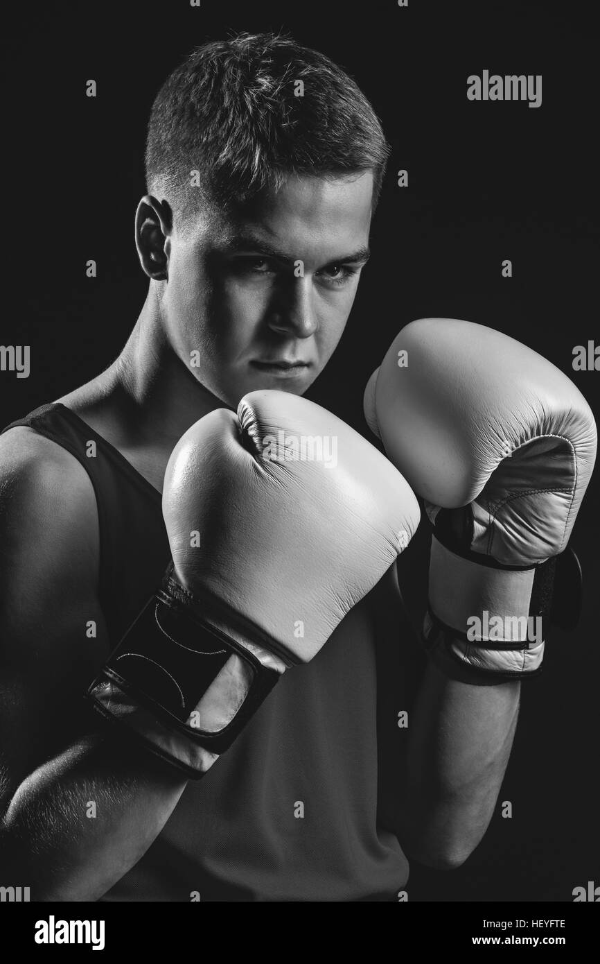 Young boxer sportsman on black background Stock Photo - Alamy