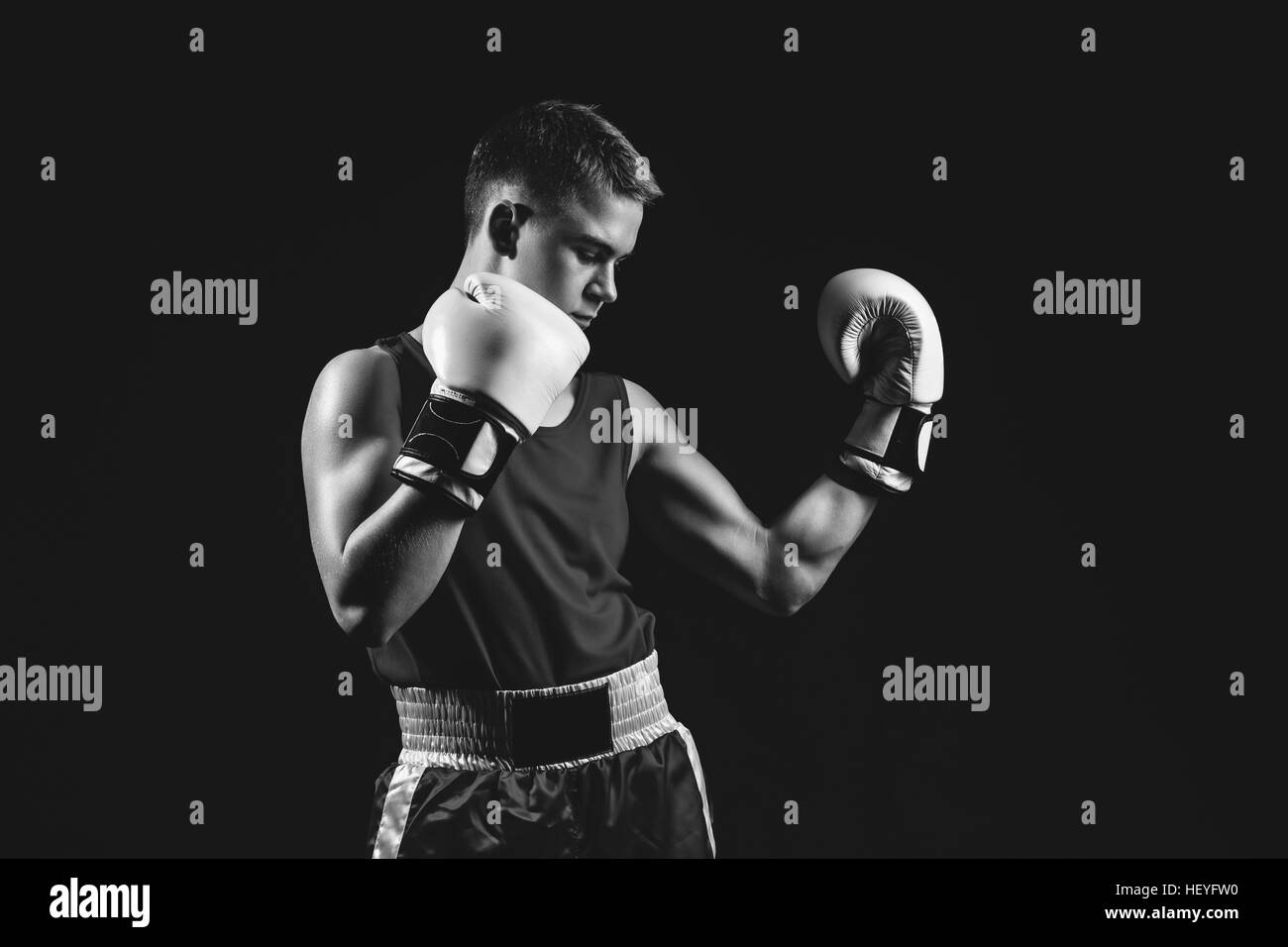 Young boxer sportsman on black background Stock Photo - Alamy