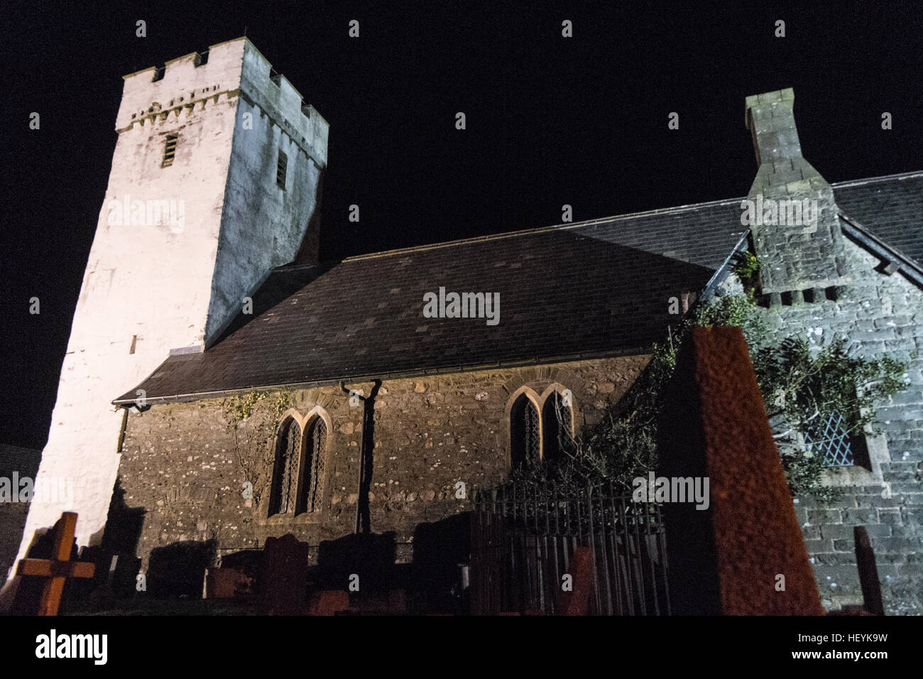 Floodlit, lit up Llansaint church in centre of Llansaint village. A ...